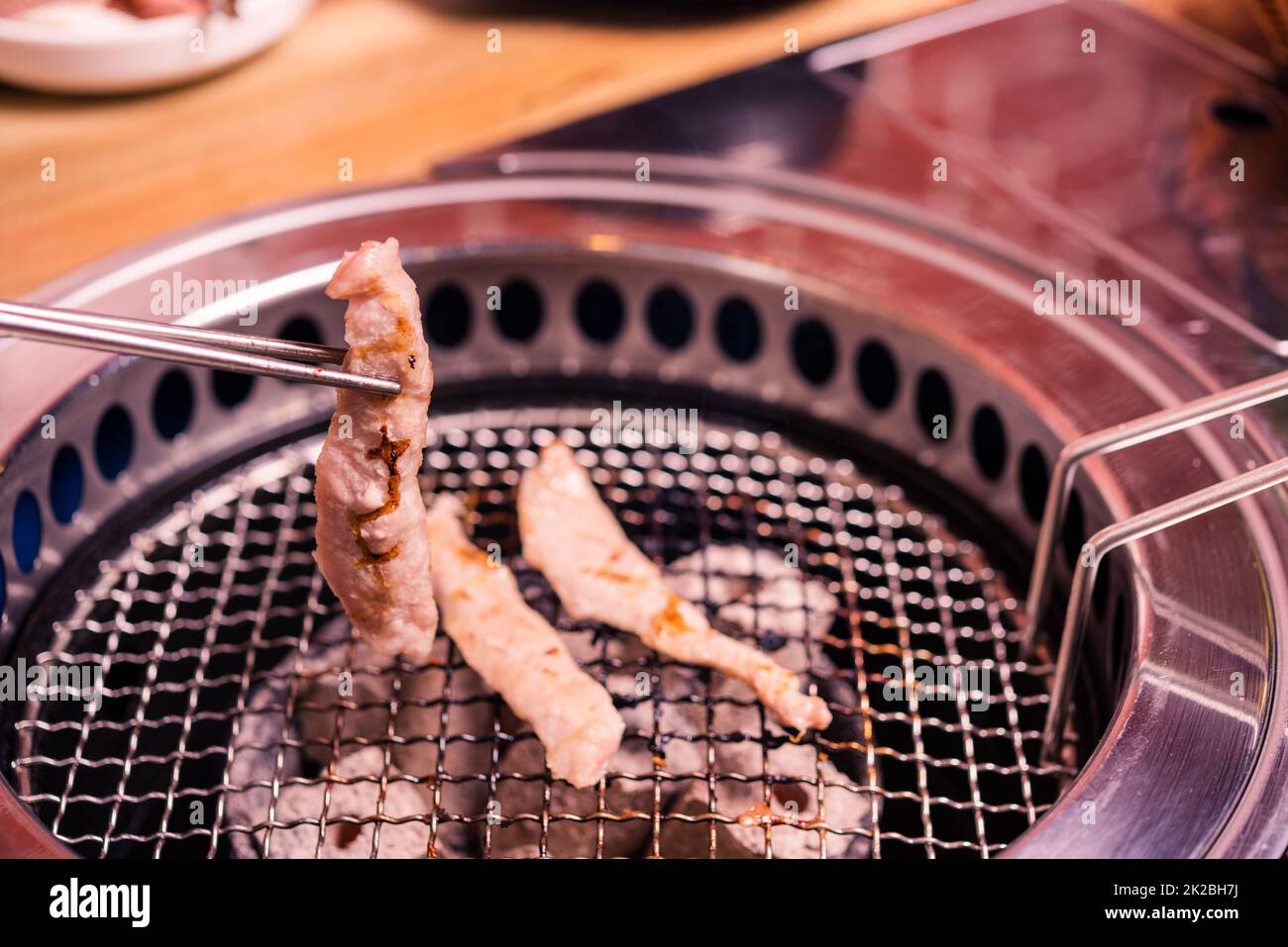 Grilling meat pork Korean BBQ traditional style on stove serve in ...