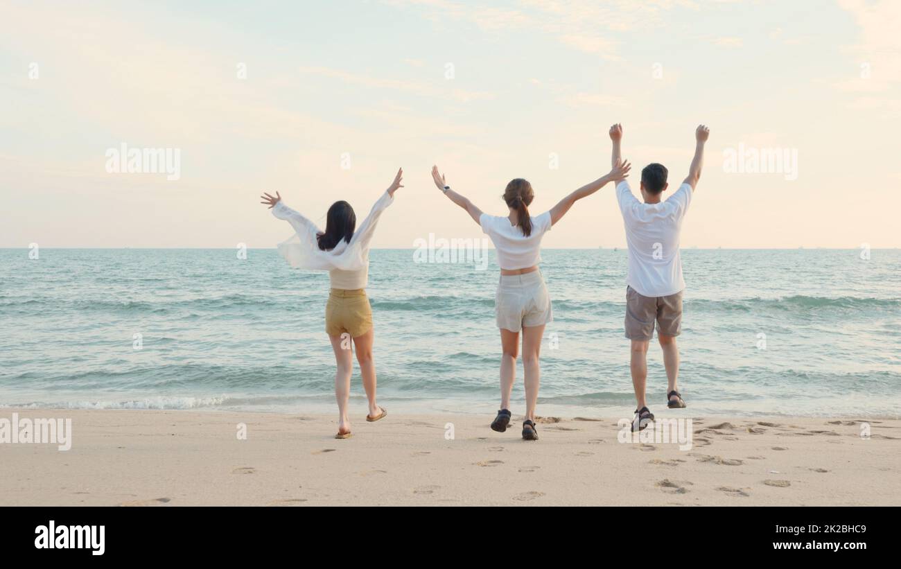 Happy friends holding hands running enjoy life funny and freedom on ...