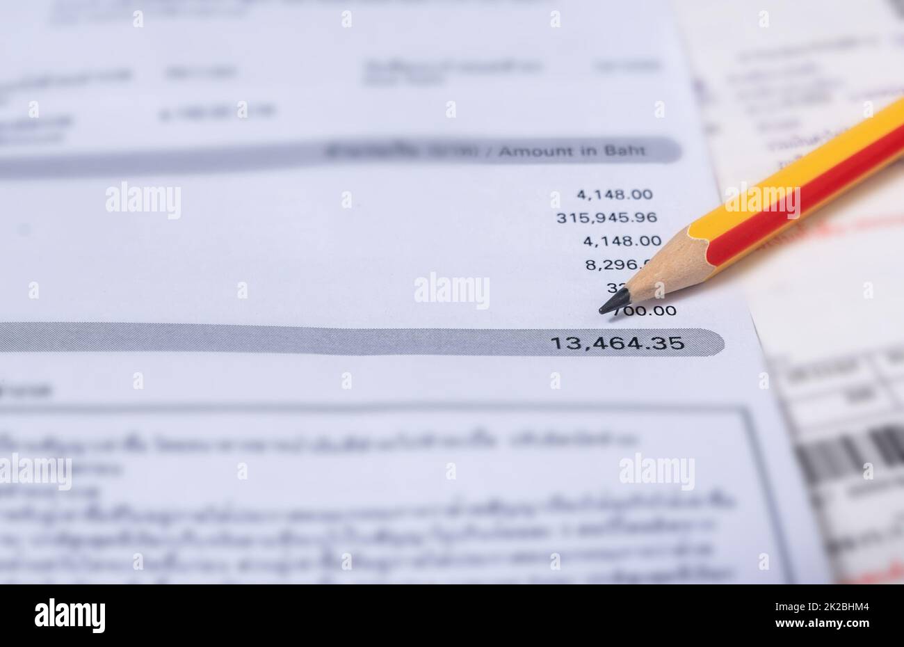 Utility energy bill with pencil blurred background Stock Photo - Alamy