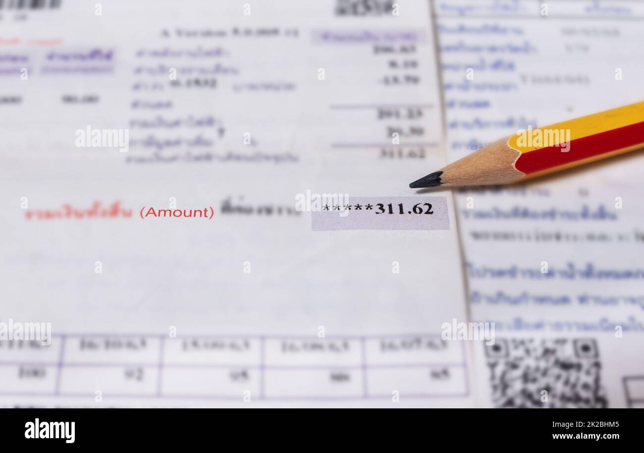 Utility energy bill with pencil blurred background Stock Photo - Alamy