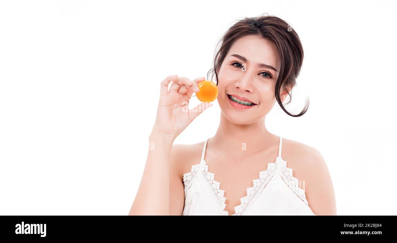 woman smiling she's holding orange handcrafted organic soap Stock Photo ...