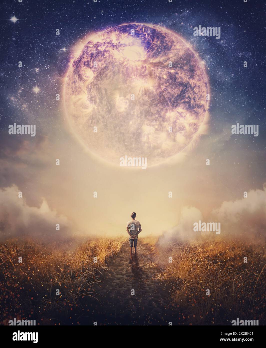 Dreamy scene with a person walking a pathway with the view to the ...