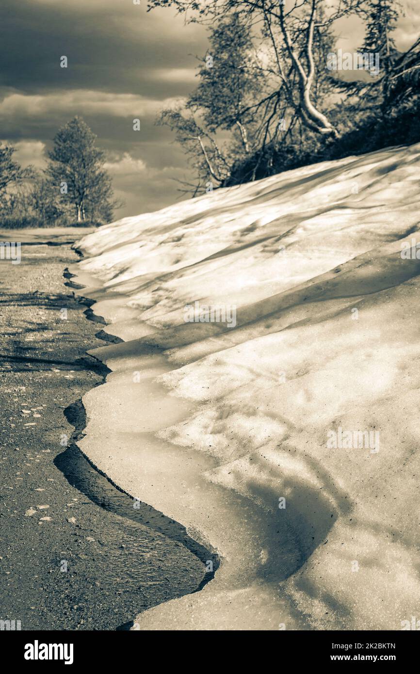 Melting snow on the road street on mountain Hemsedal Norway Stock Photo ...