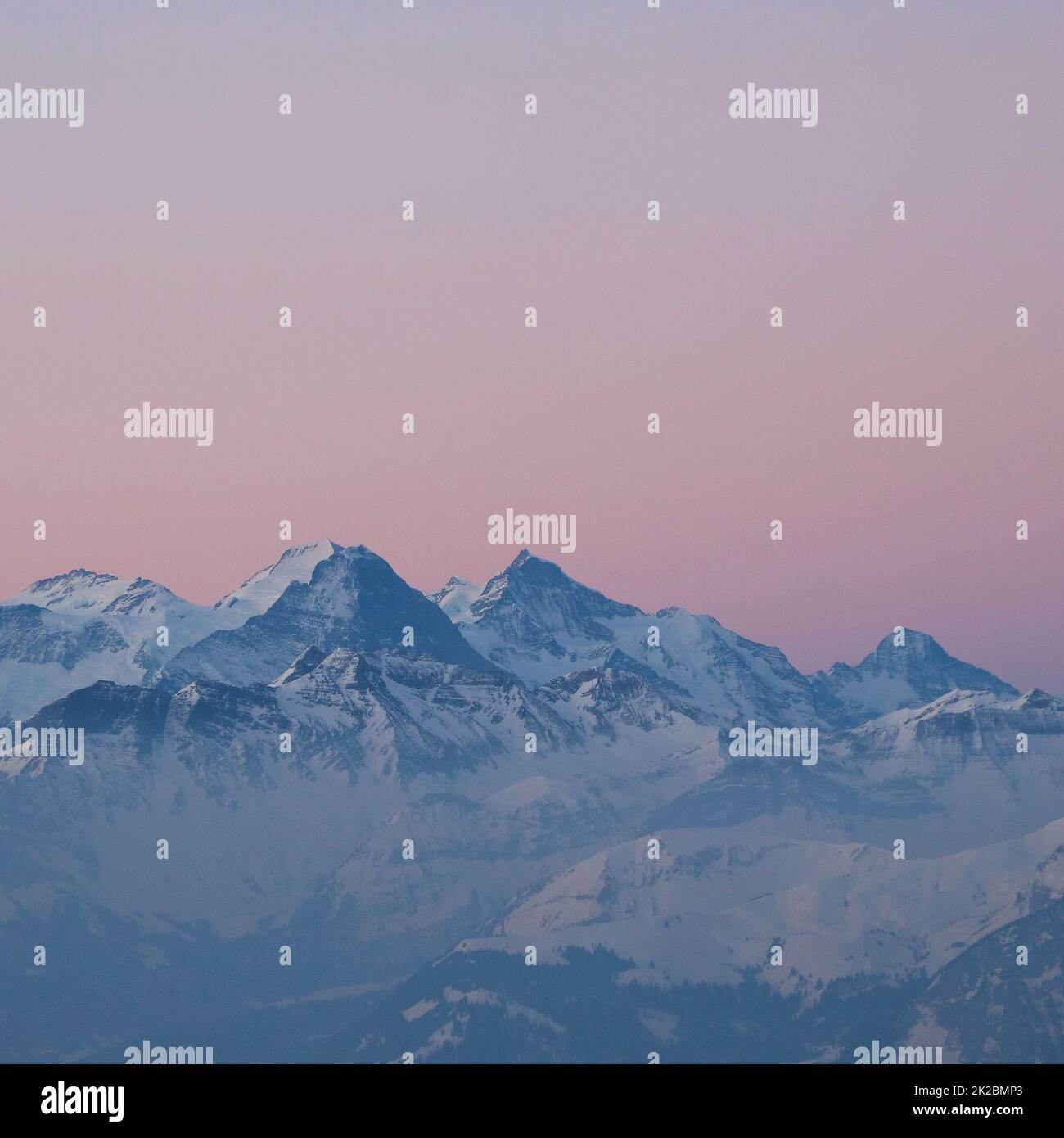 Pink sky over Eiger, Monch and Jungfrau. Sunrise scene in the Swiss ...