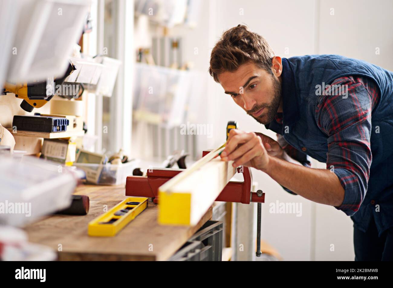Down to the very last detail. Shot of a handsome young carpenter ...