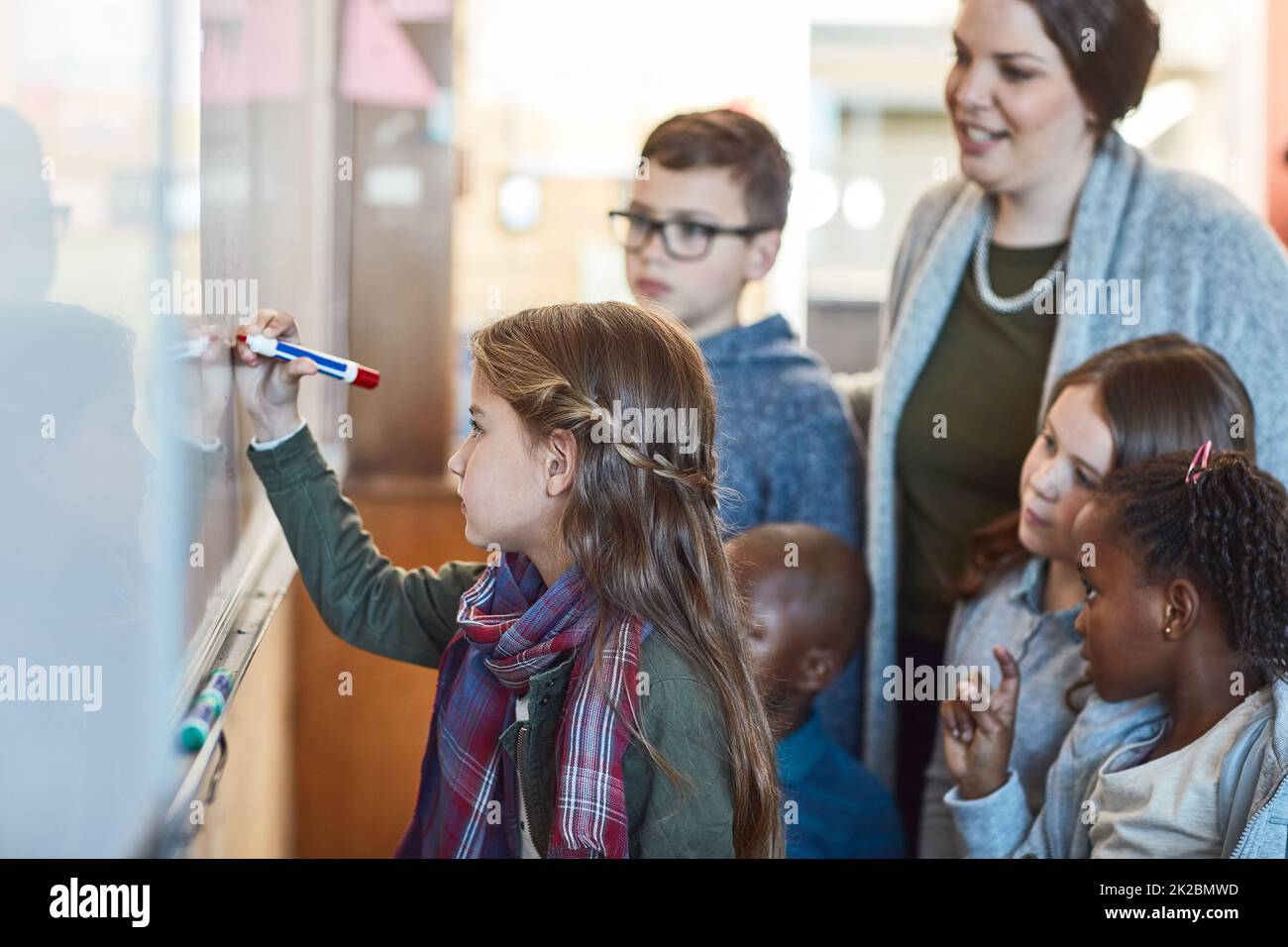 Girl writing whiteboard school hi-res stock photography and images - Alamy