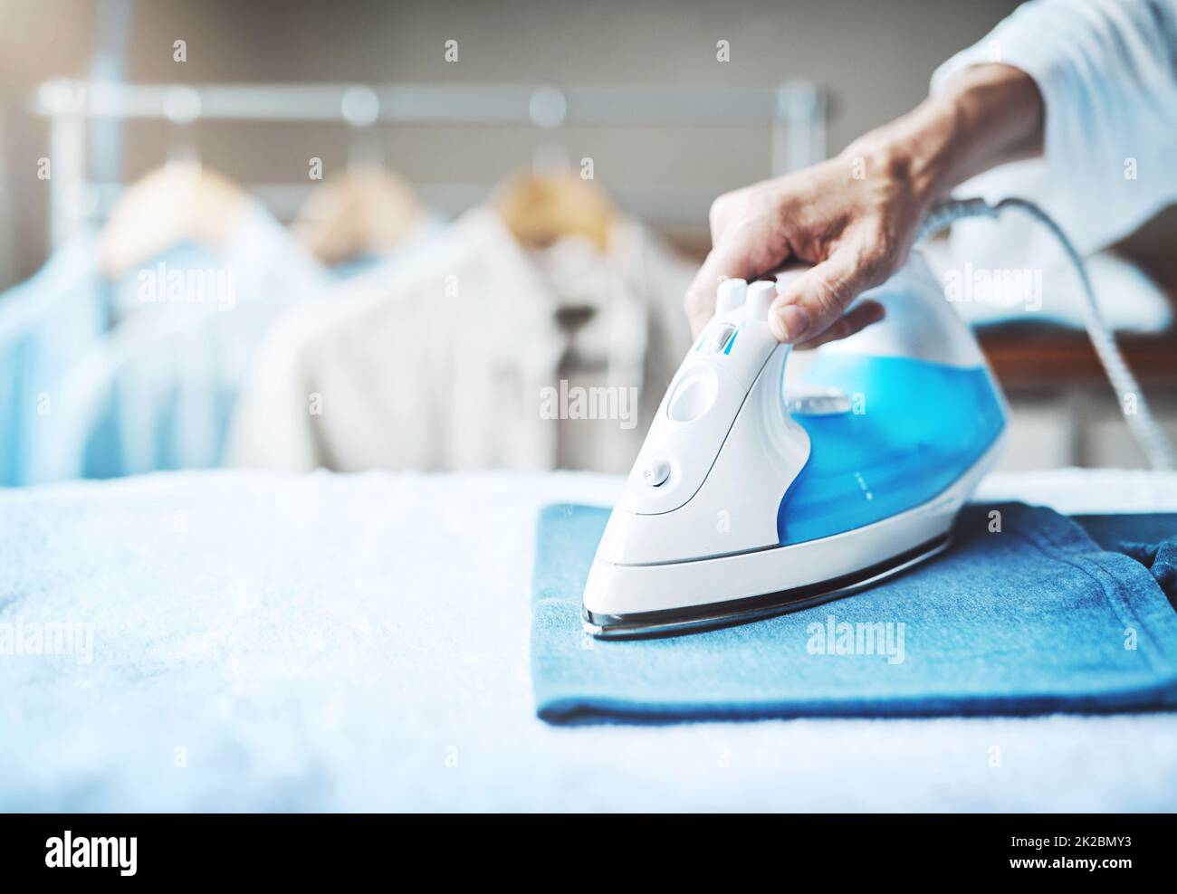 Smoothing creases hi-res stock photography and images - Alamy