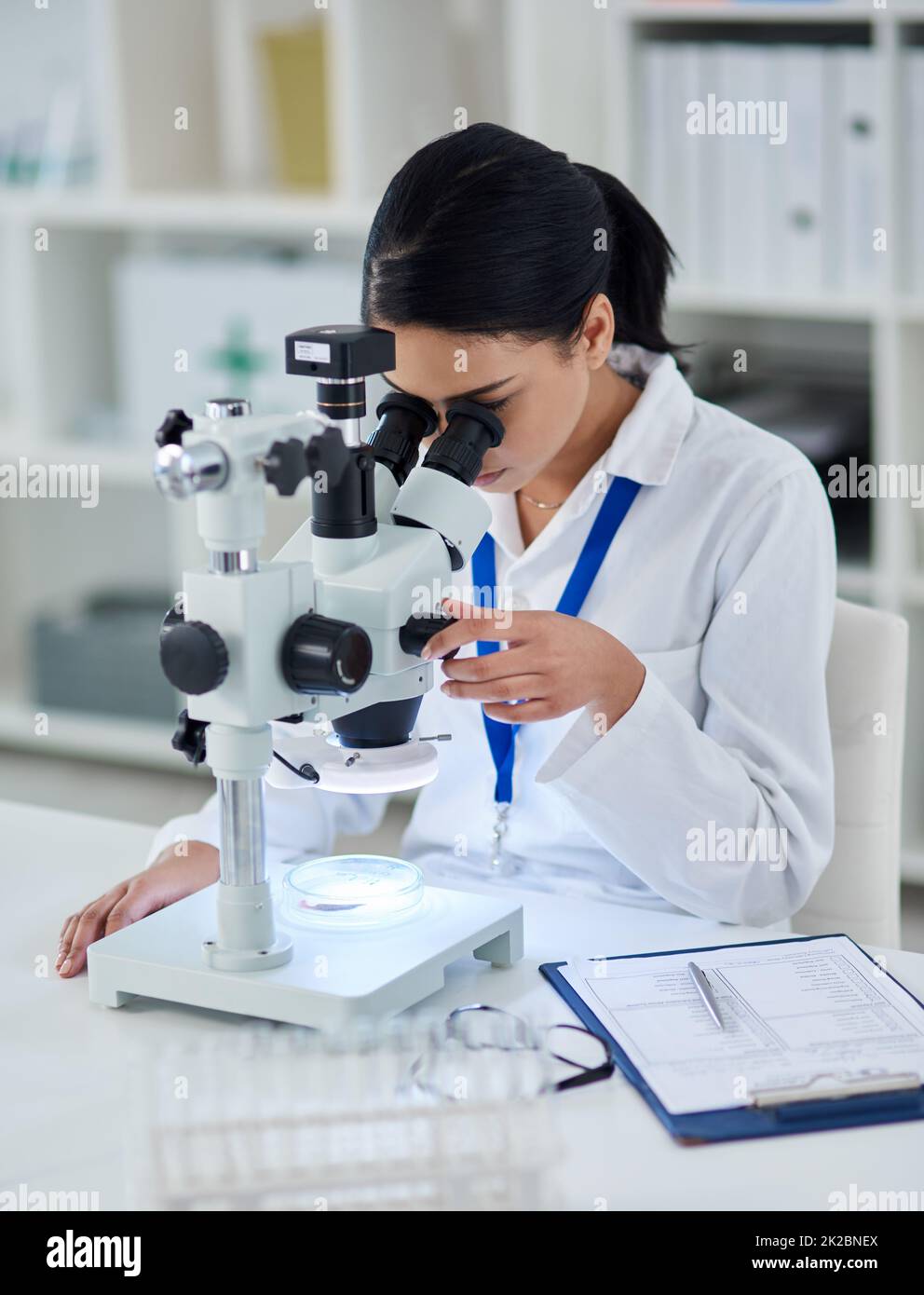 Theres nothing her microscope cant find. Shot of a young scientist ...