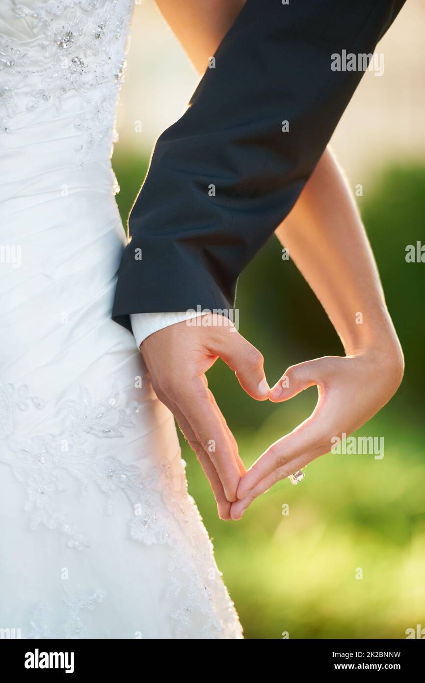 Young married couple making heart hi-res stock photography and images ...