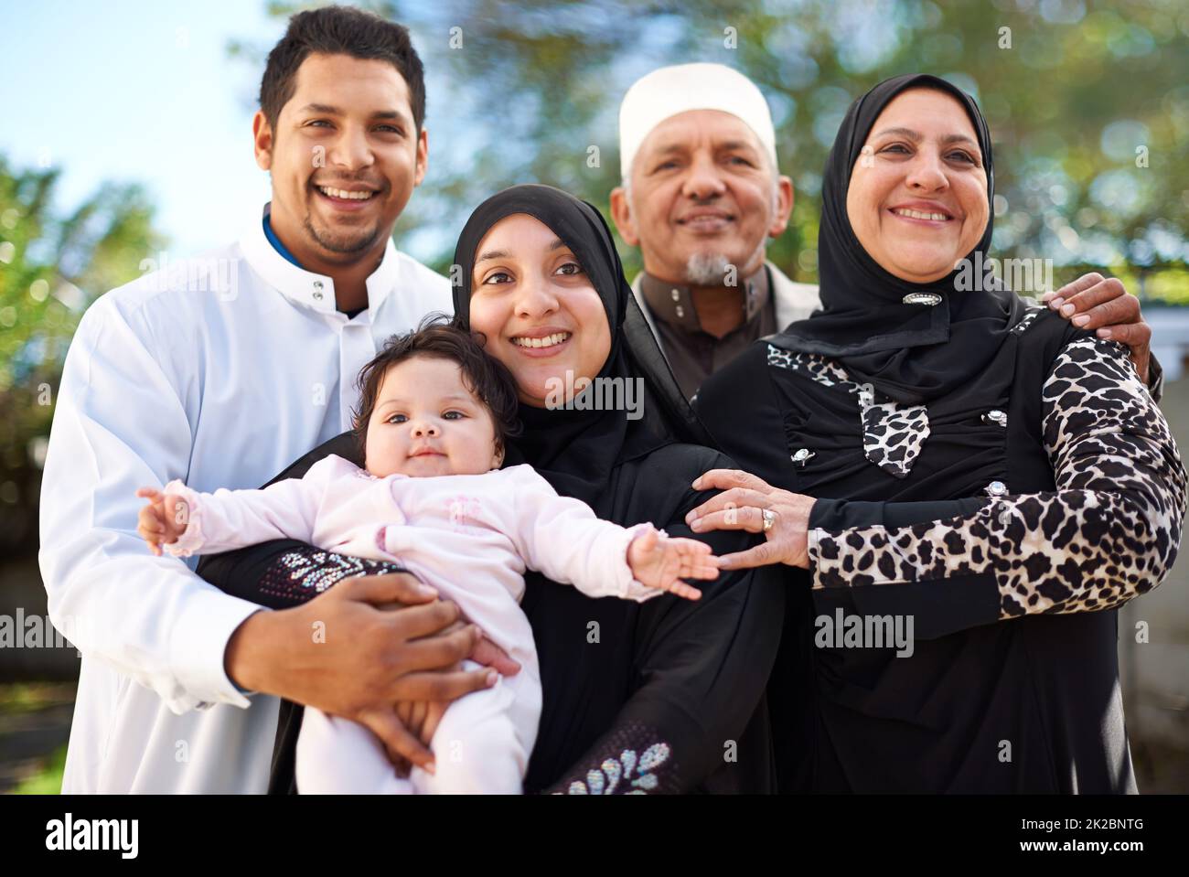 One big happy family. A muslim family enjoying a day outside Stock ...