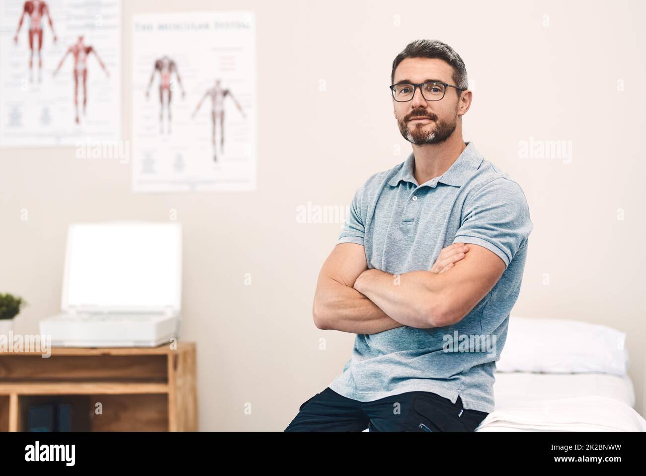 Serious muscular man arms folded hi-res stock photography and images ...