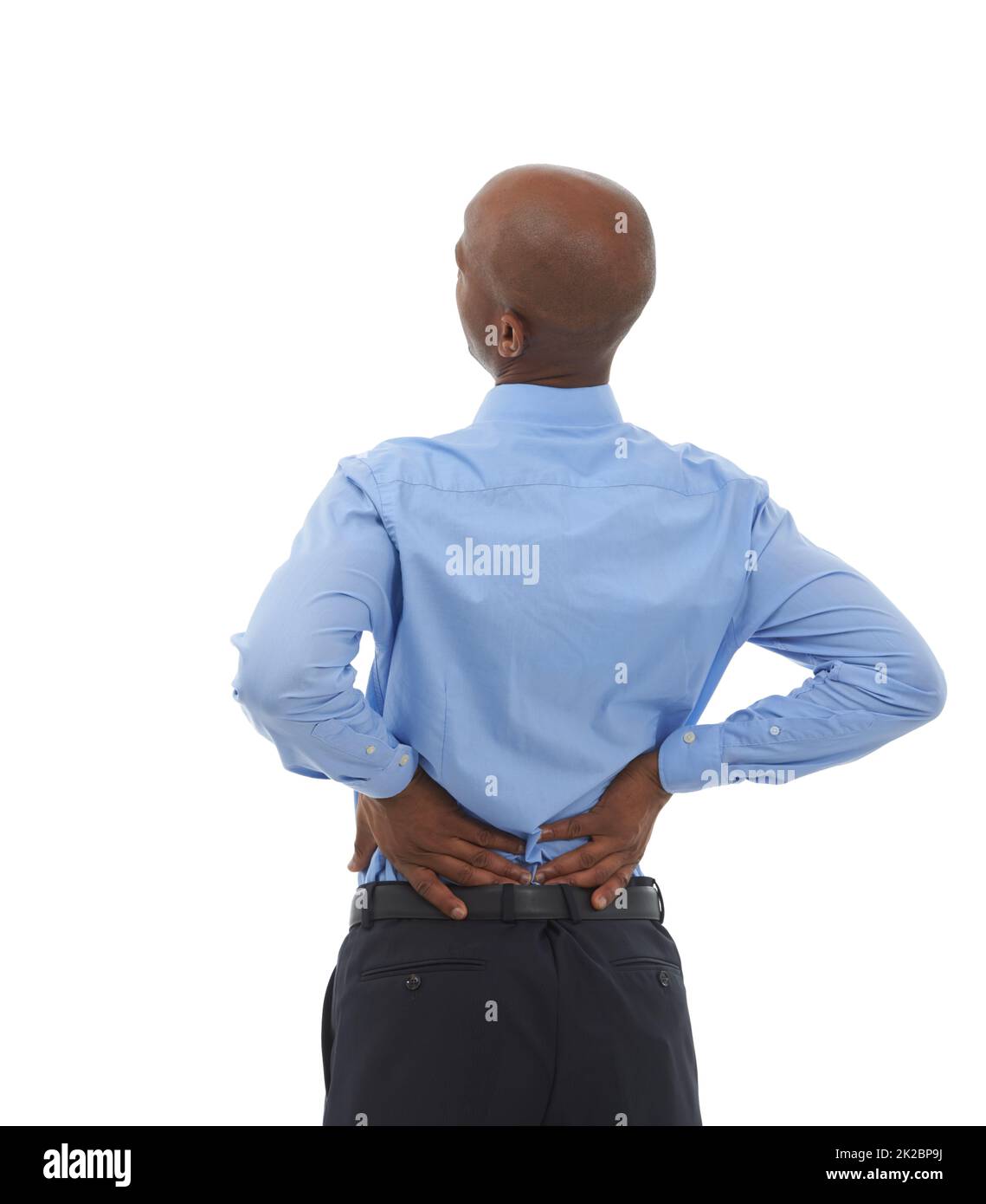 Feeling the effects of sitting all day. Rearview studio shot of an ...