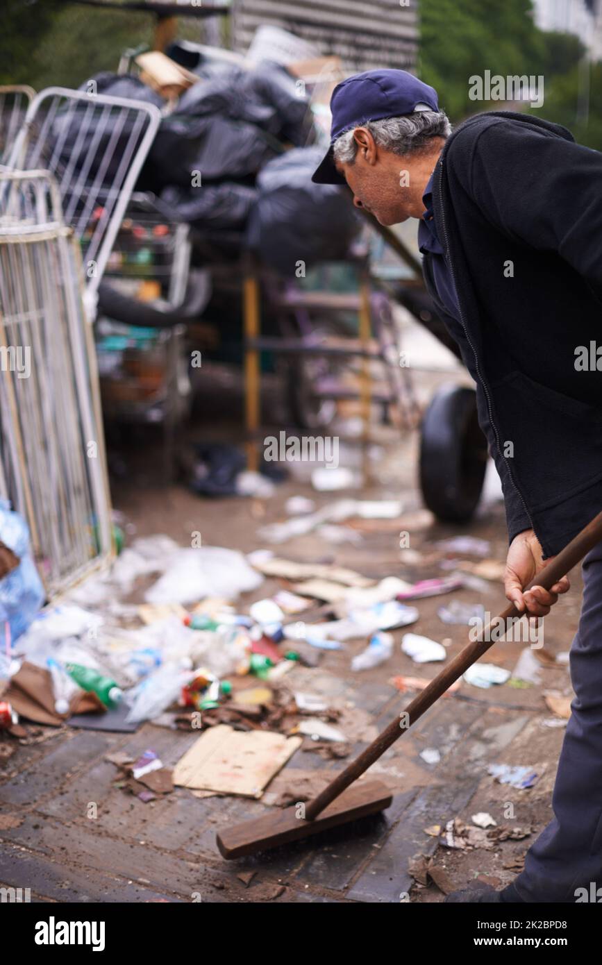 Man sweeping street hi-res stock photography and images - Alamy
