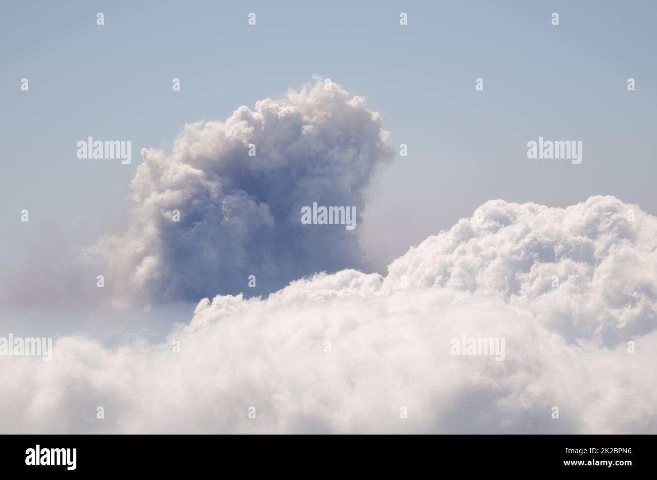 Sea of clouds and smoke plume from a volcanic eruption Stock Photo - Alamy