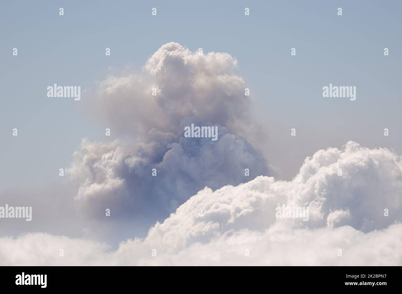 Sea of clouds and smoke plume from a volcanic eruption Stock Photo - Alamy