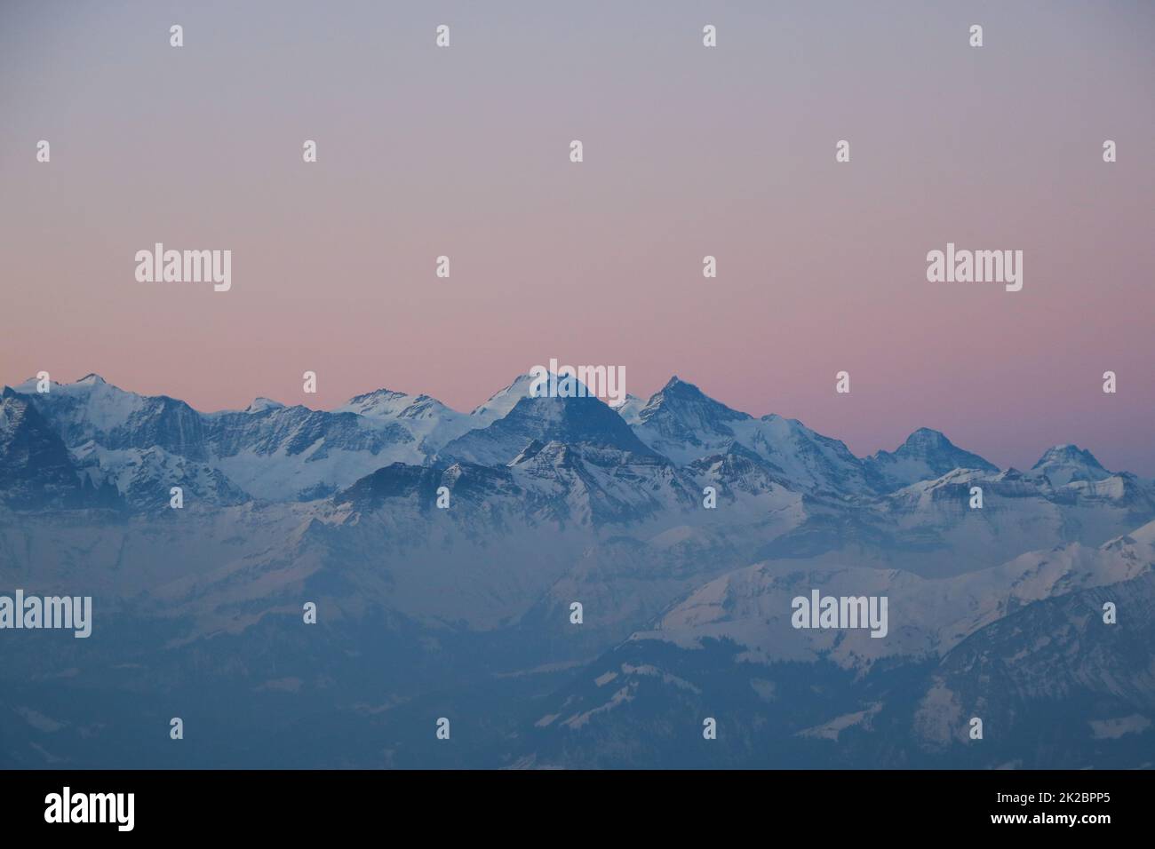 Pink sky over Eiger, Monch and Jungfrau. Sunrise scene in the Swiss ...