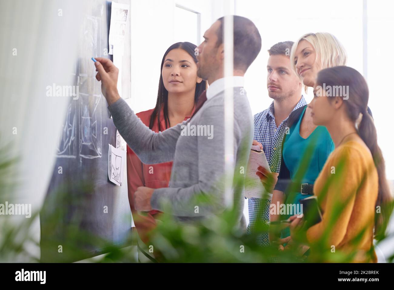 Teamwork will get them to their goal faster. A team of businesspeople ...