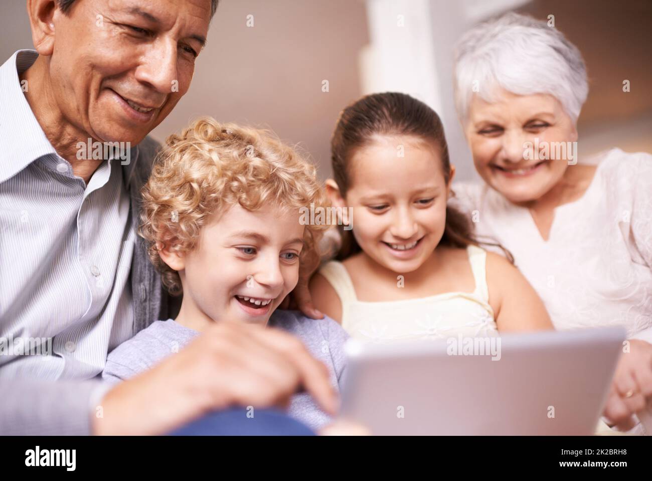 Child and ipad and grandparents hi-res stock photography and images - Alamy
