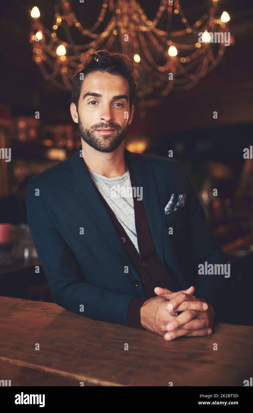 Waiting for my drink.... Cropped portrait of a young man sitting in a ...
