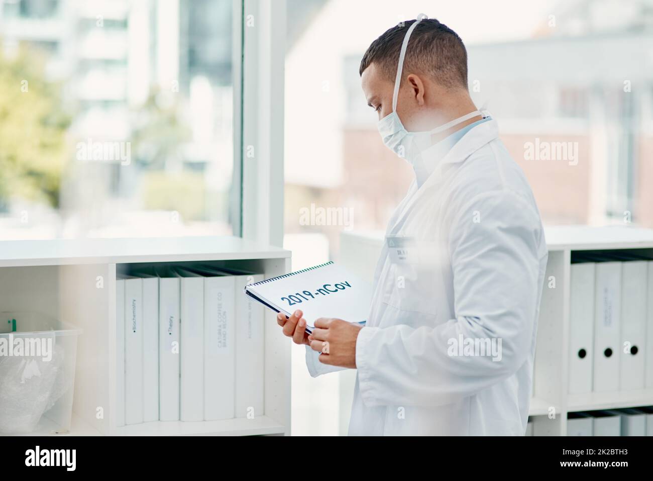 Covid-19 is keeping scientists on their toes. Shot of a young scientist ...