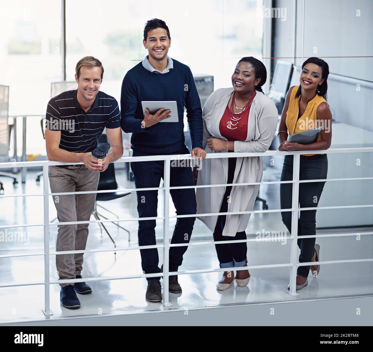 Success is on their side. Portrait of a group of smiling colleagues ...