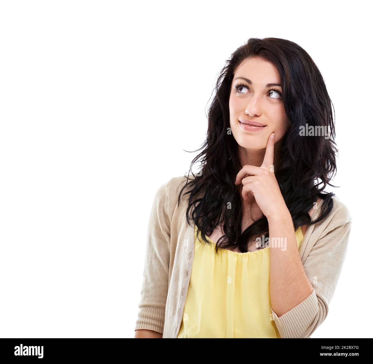 Remembering the days.... A young woman thinking against a white ...