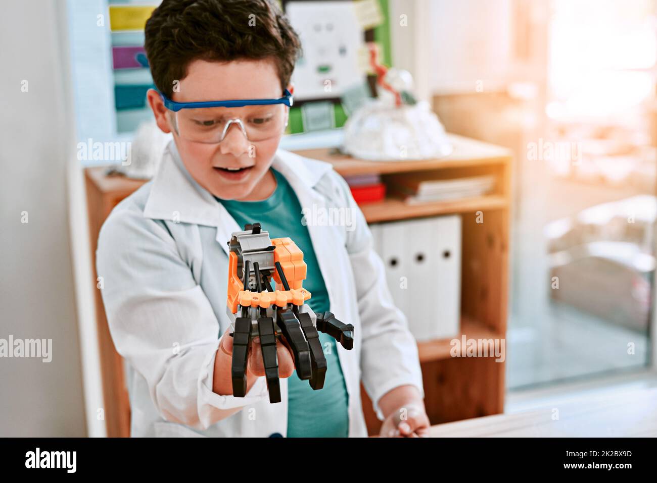 Today a toy, tomorrow a real robot. Shot of an adorable little boy ...