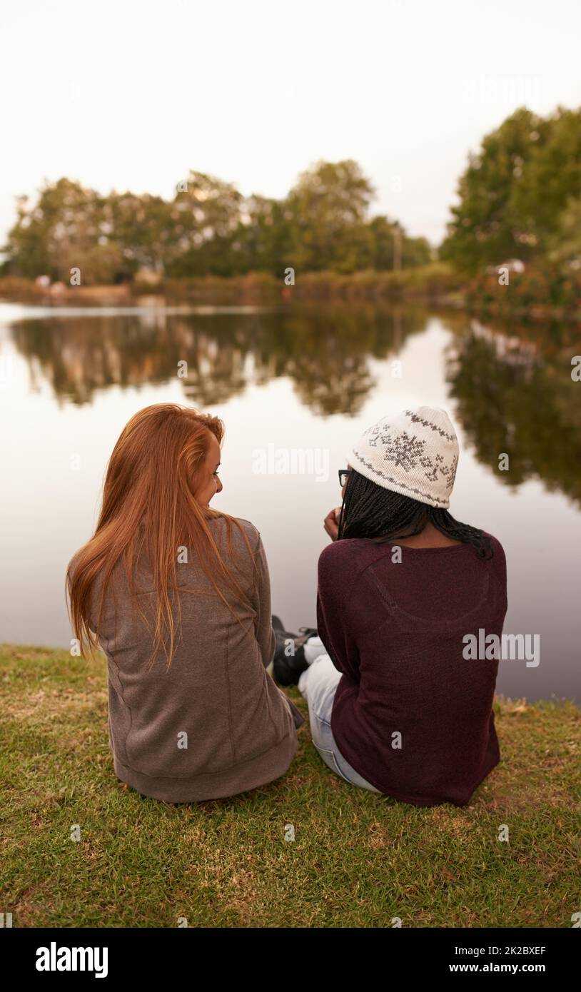 Two women sitting rear view hi-res stock photography and images - Alamy
