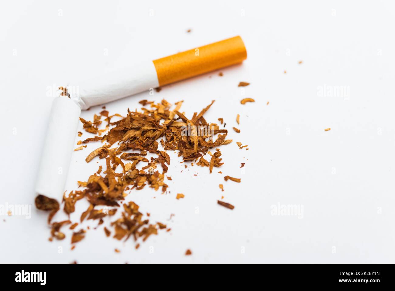 broken pile cigarette or tobacco on white background Stock Photo - Alamy