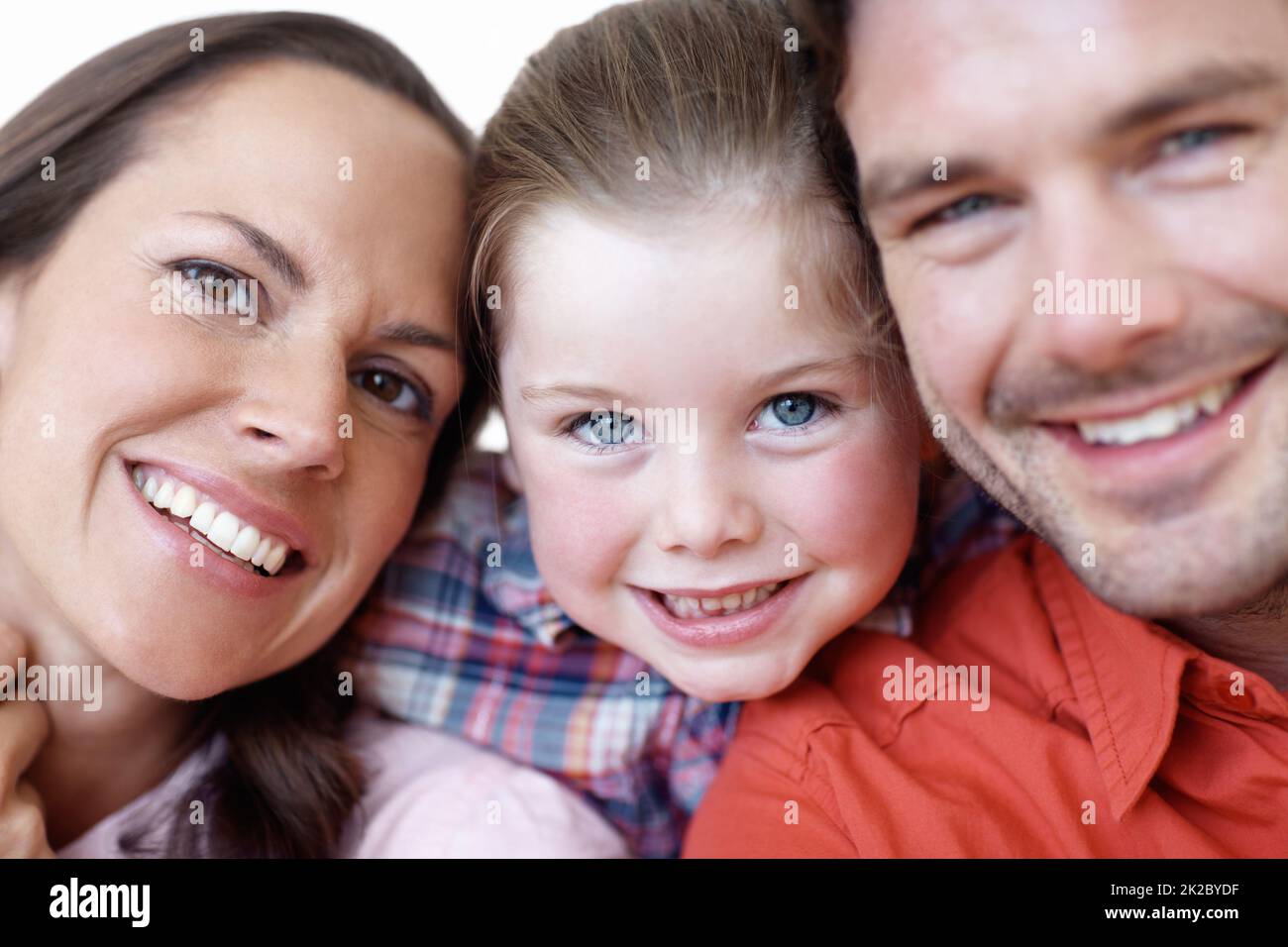 Smiling runs in the family. Close-up portrait of a young family Stock ...