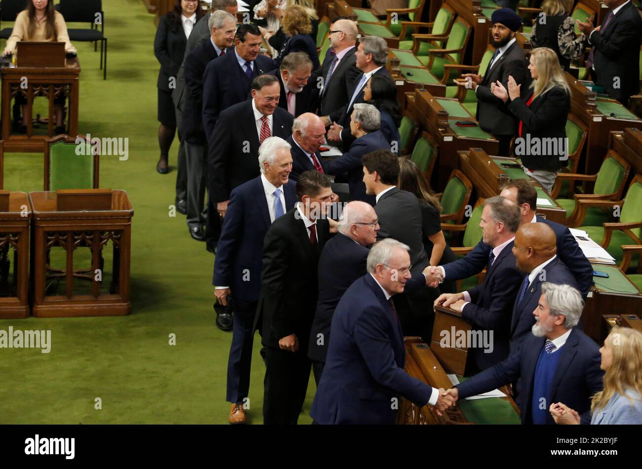 Prime Minister Justin Trudeau speaks with Paul Henderson and members of ...