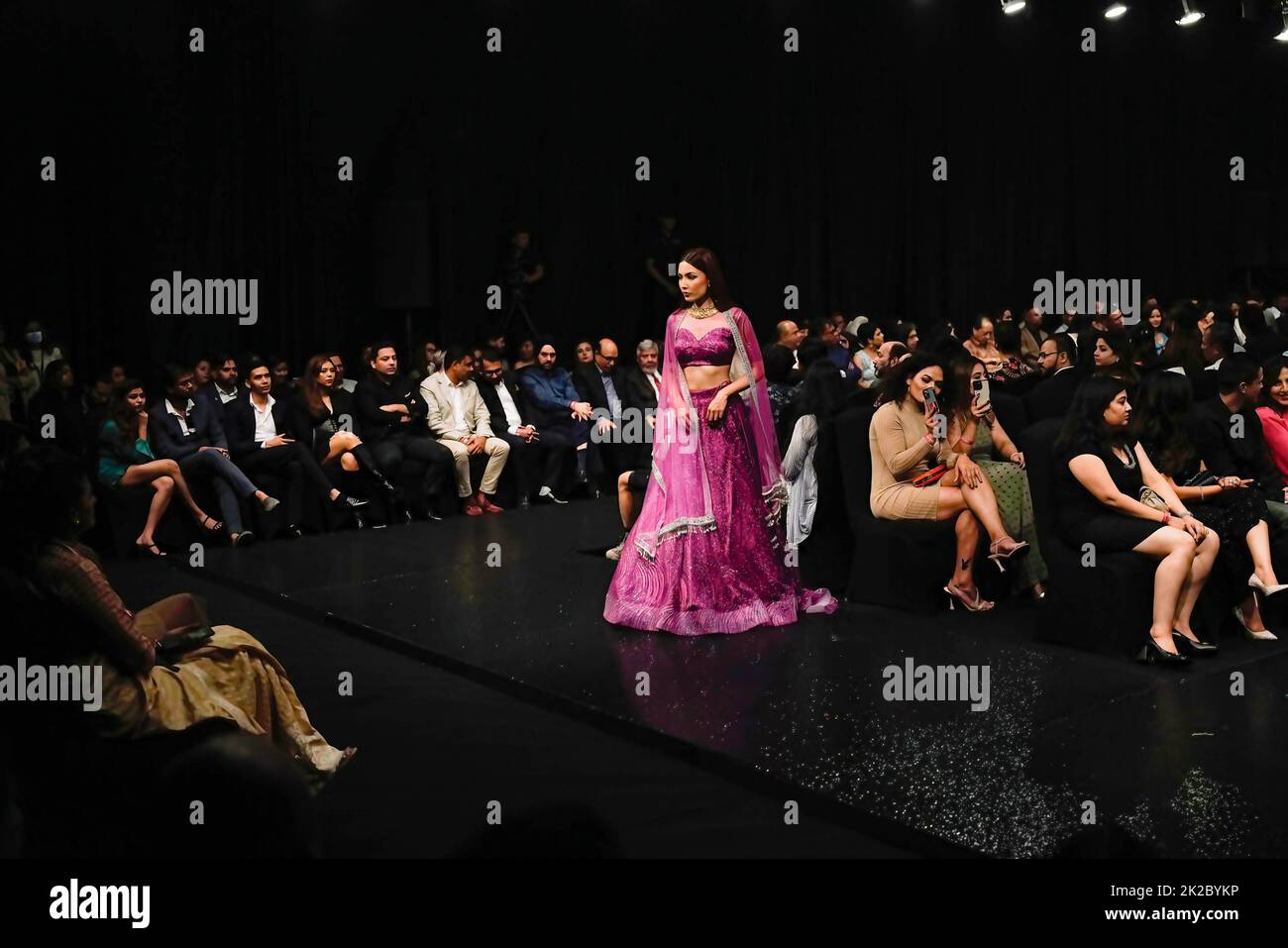 A model walks the runway wearing designer dress on the first day of ...
