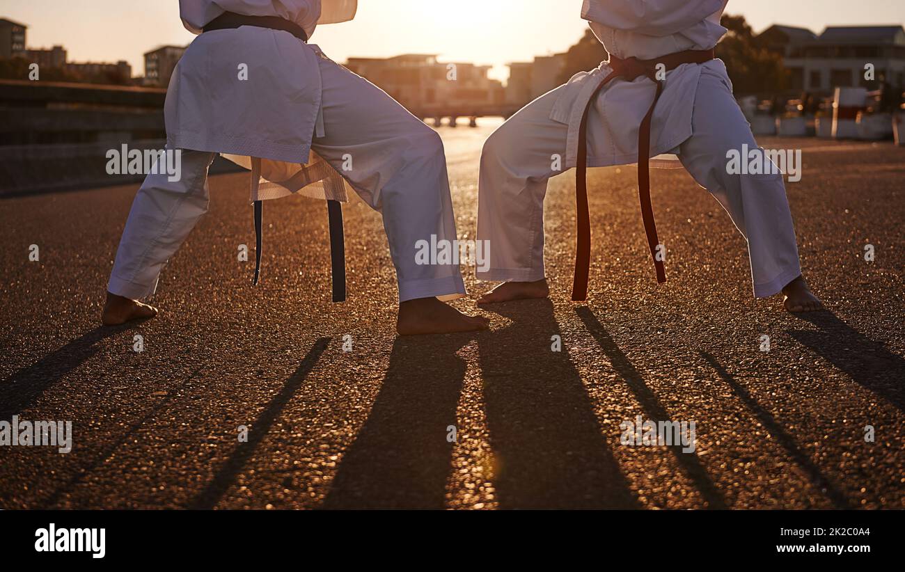 Ready for battle. Two sportspeople facing off and practicing their ...