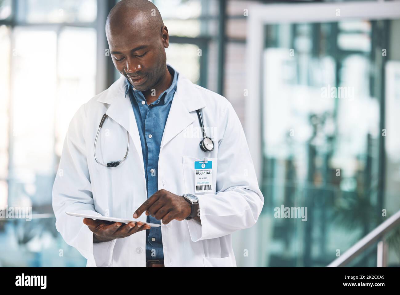 Doctor with tablet, happy reading social media post, text or email from ...