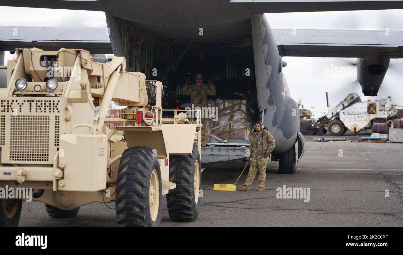 Members of Joint Task Force – Alaska off load equipment and supplies ...