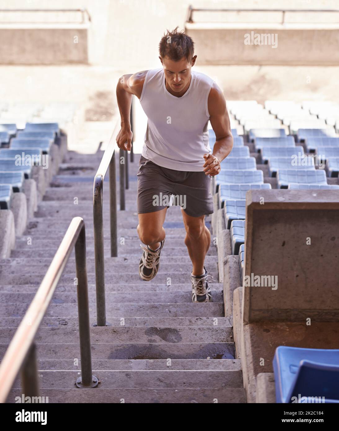 Youve got to push hard to win. Shot of an athlete running up a flight ...