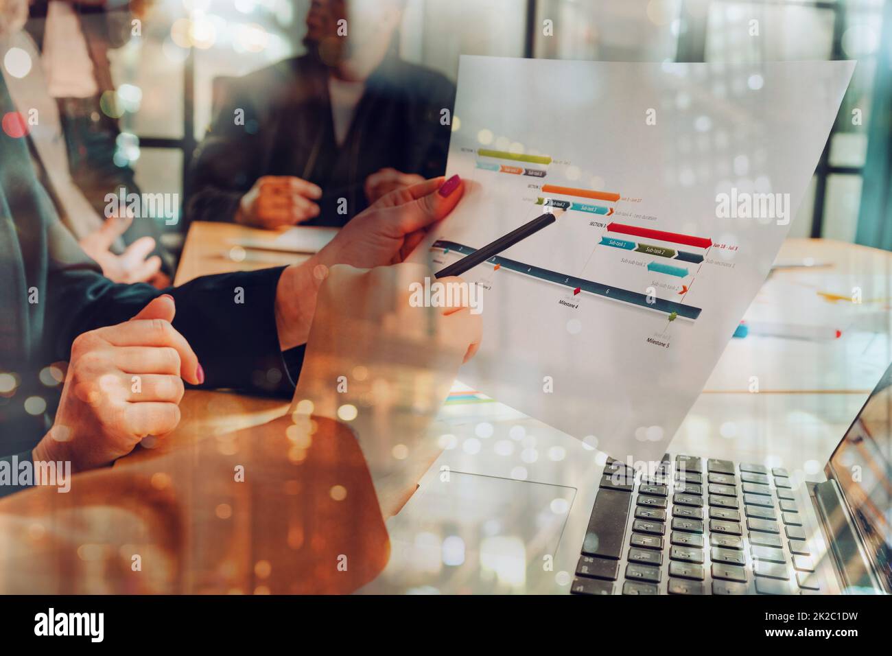 Group of business people have a meeting about company stats Stock Photo ...