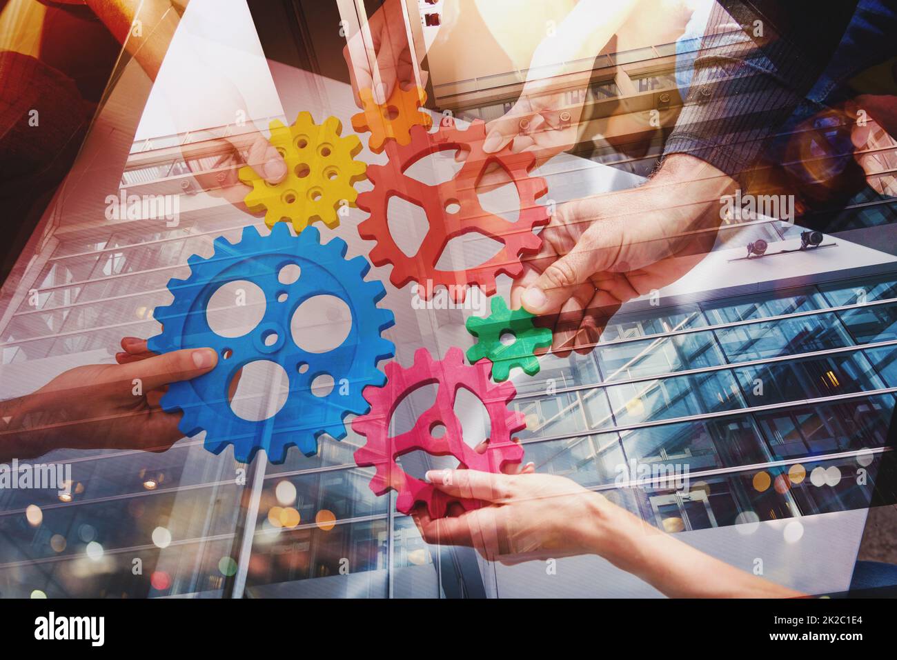 Business team connect pieces of gears like a teamwork and partners ...