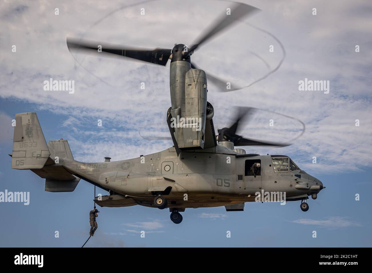 U.S. Marines with III Marine Expeditionary Force (MEF) fast rope from ...