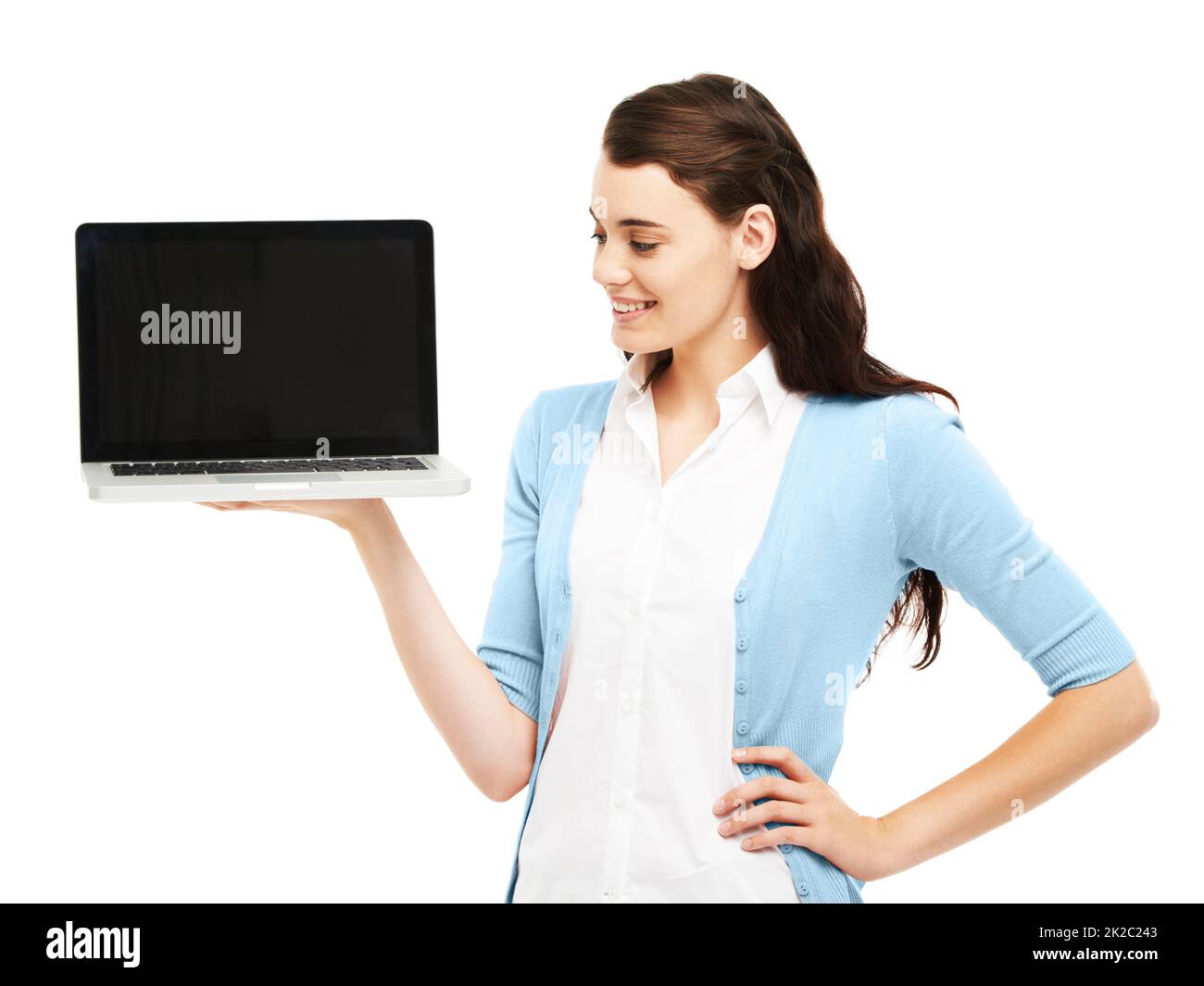 Technology makes life so much easier. Pretty young woman holding up a ...