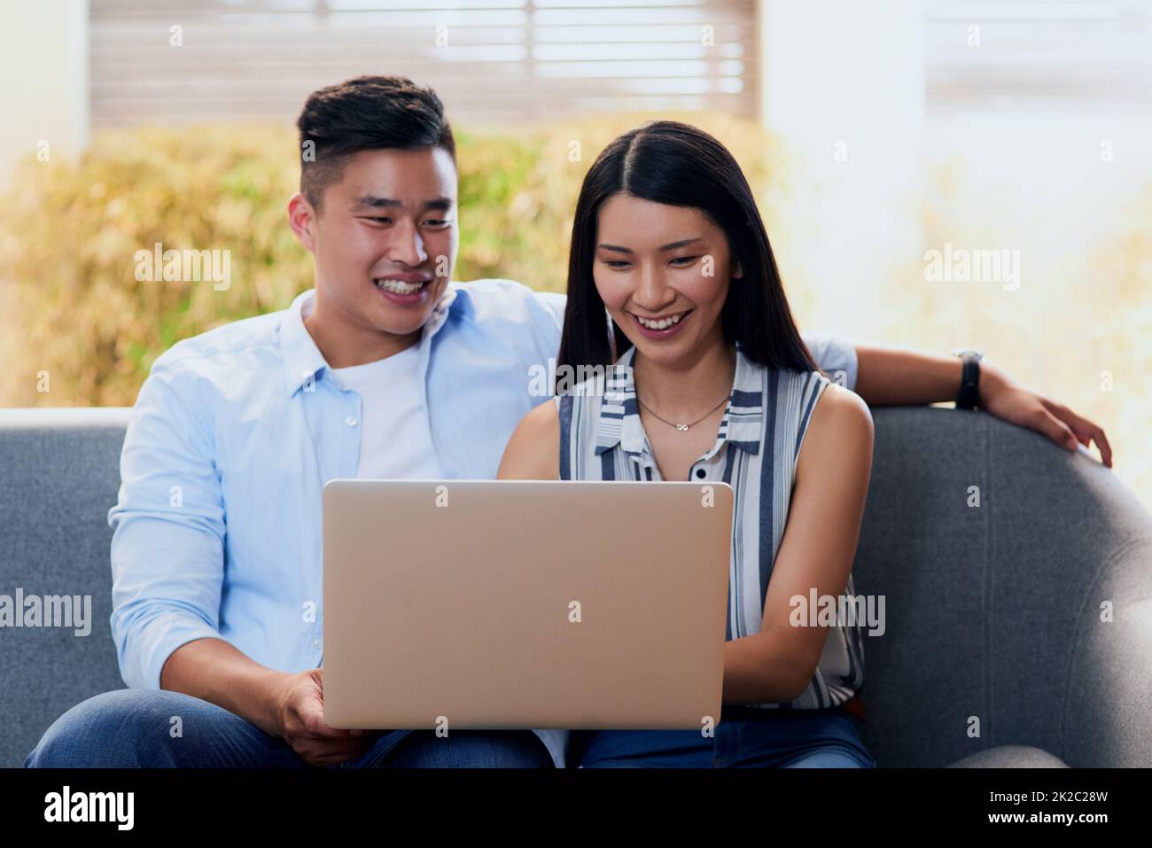 Asian couple using computer hi-res stock photography and images - Alamy