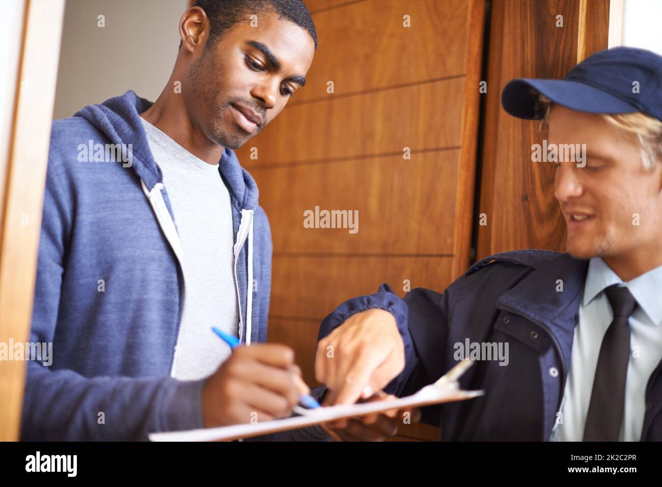 Signing a form outside hi-res stock photography and images - Alamy