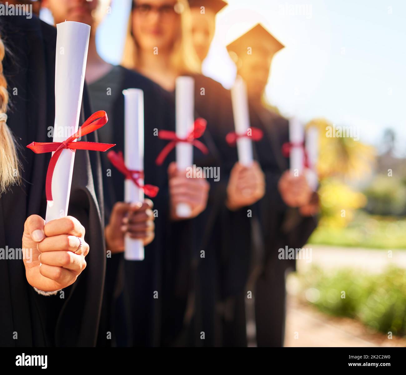 Our tickets to the good life. Closeup shot of a group of unrecognizable ...