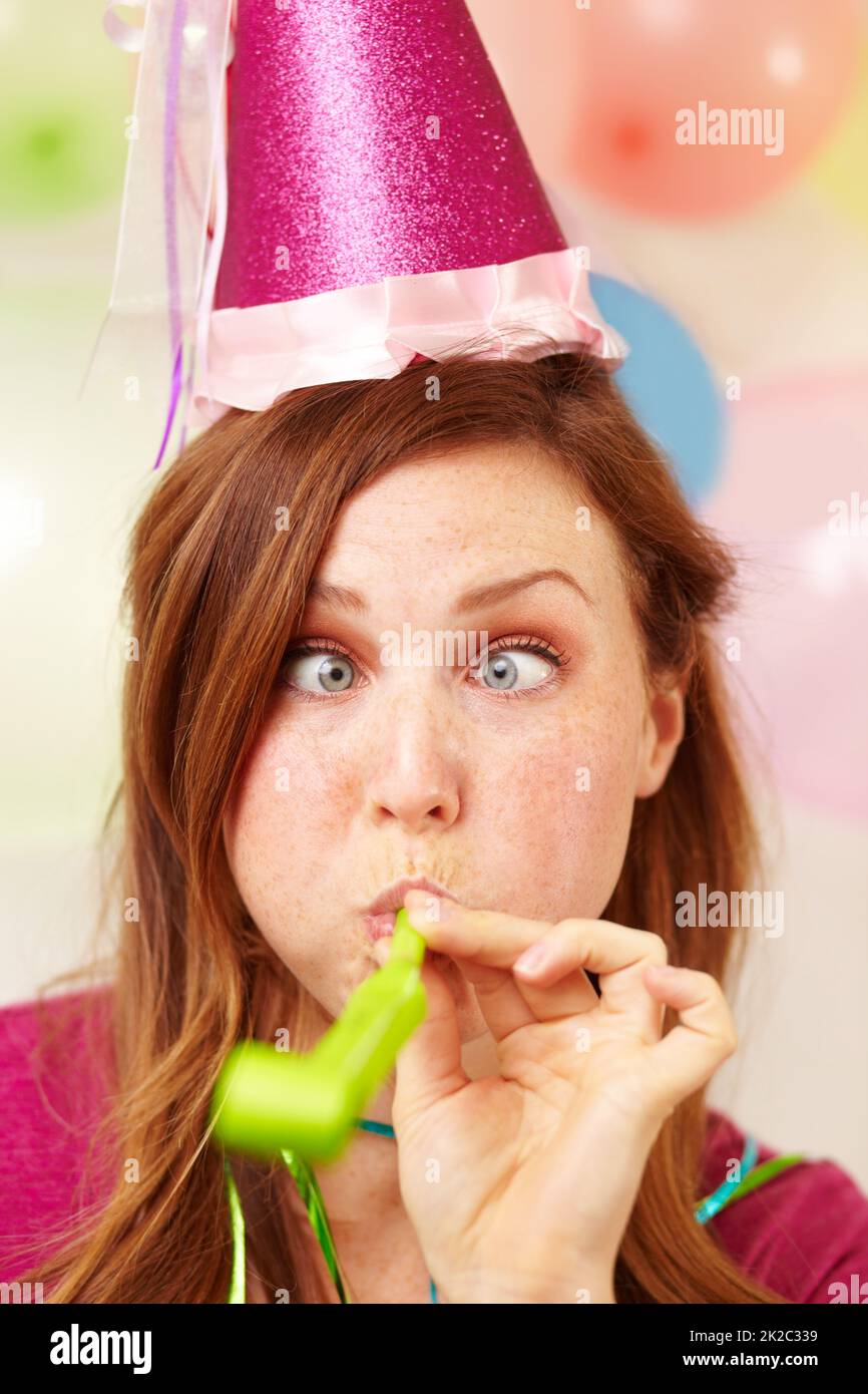 Young woman blowing a balloon people hi-res stock photography and ...