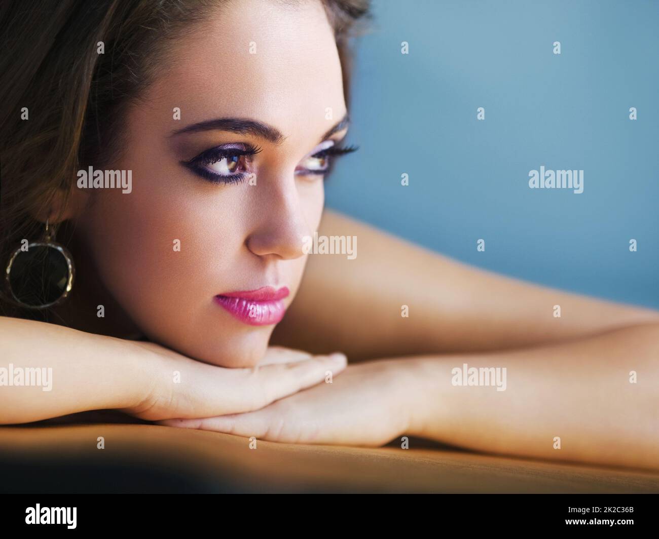 Woman resting head on hands hi-res stock photography and images - Alamy