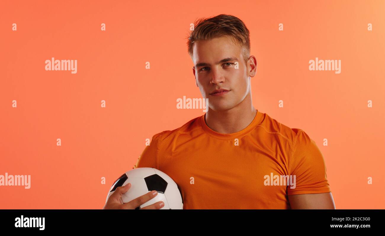Football player posing soccer ball hi-res stock photography and images ...