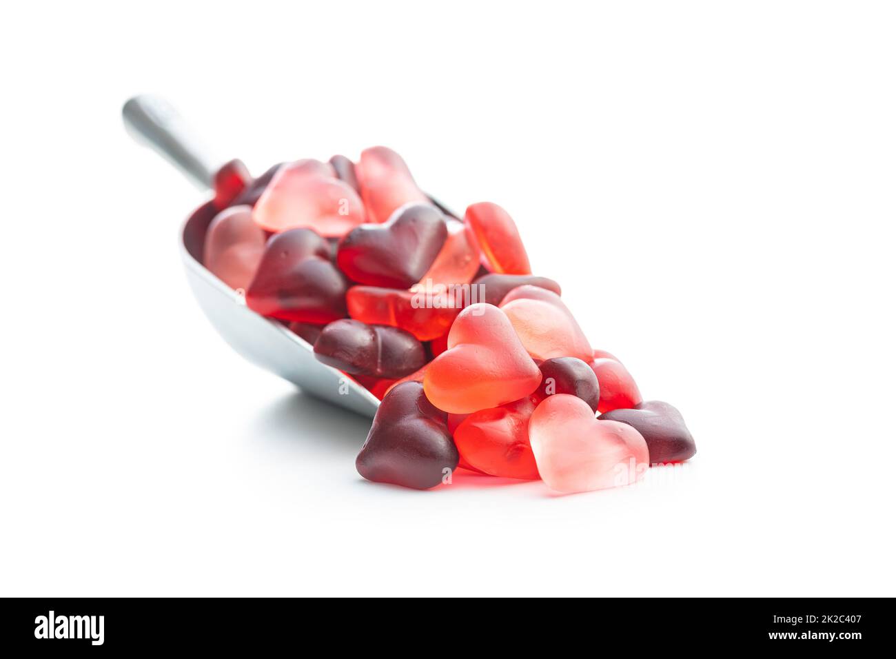 Heart shaped jelly candy in scoop isolated on white backgorund Stock ...