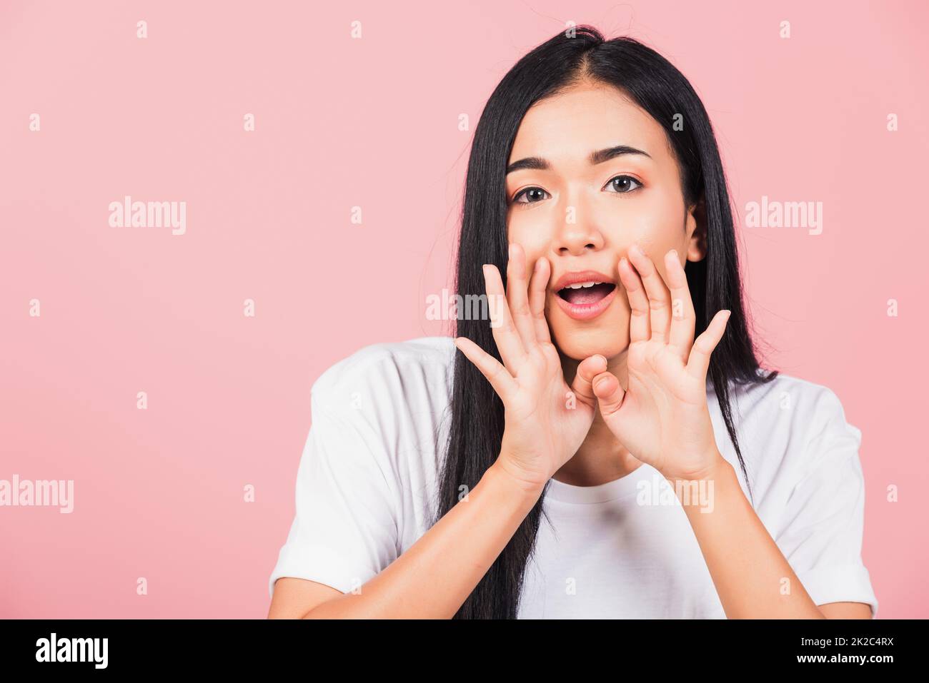 woman teen standing hand on mouth talking whisper secret rumor Stock ...