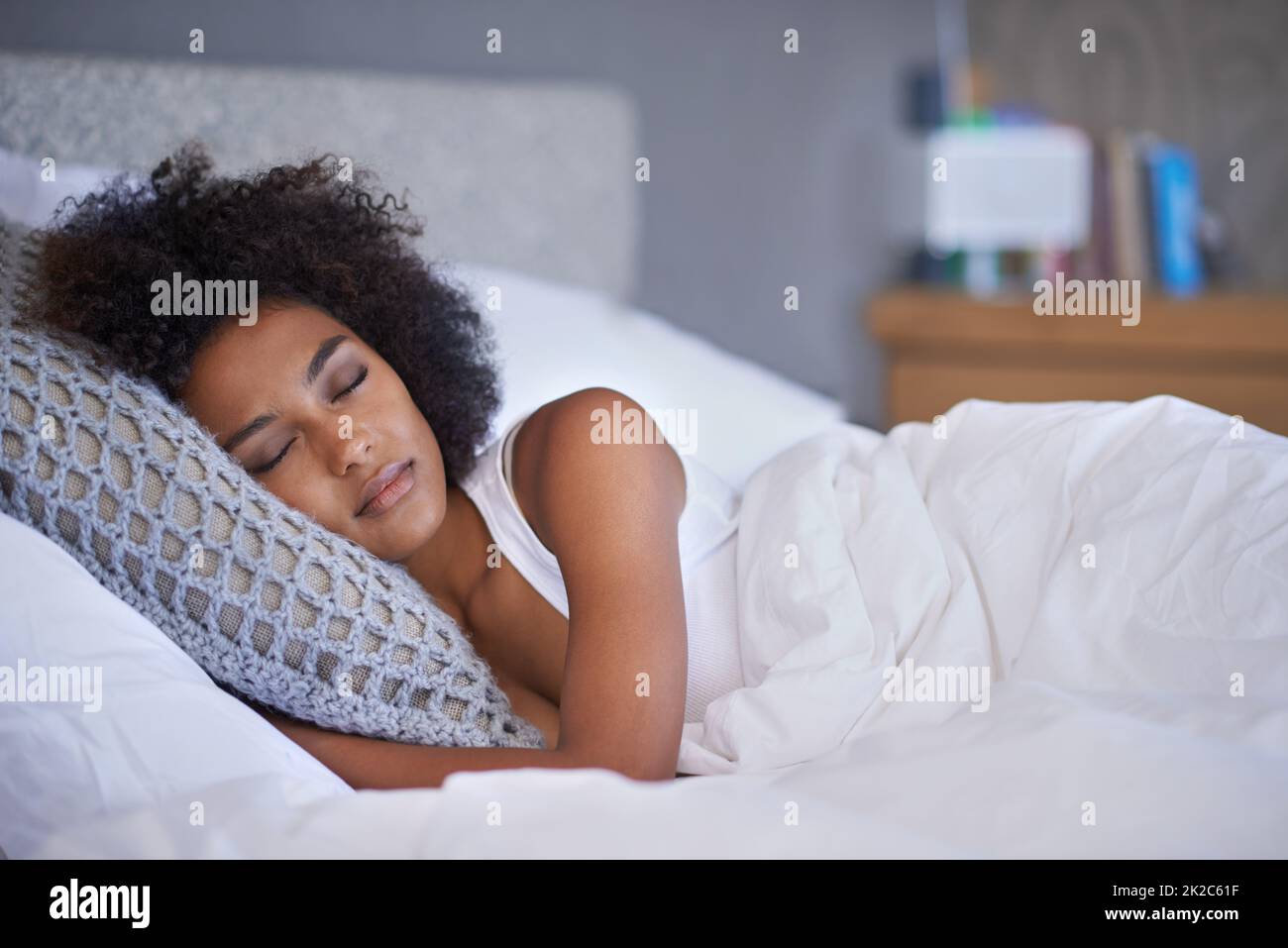 Woman sleeping on side pillow hi-res stock photography and images - Alamy