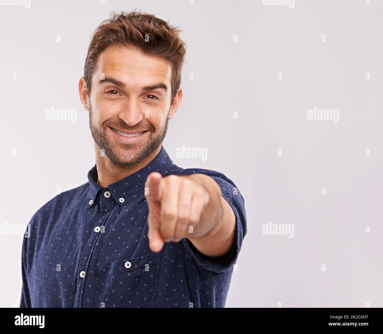 Hes made his choice. A handsome young casually dress man pointing ...